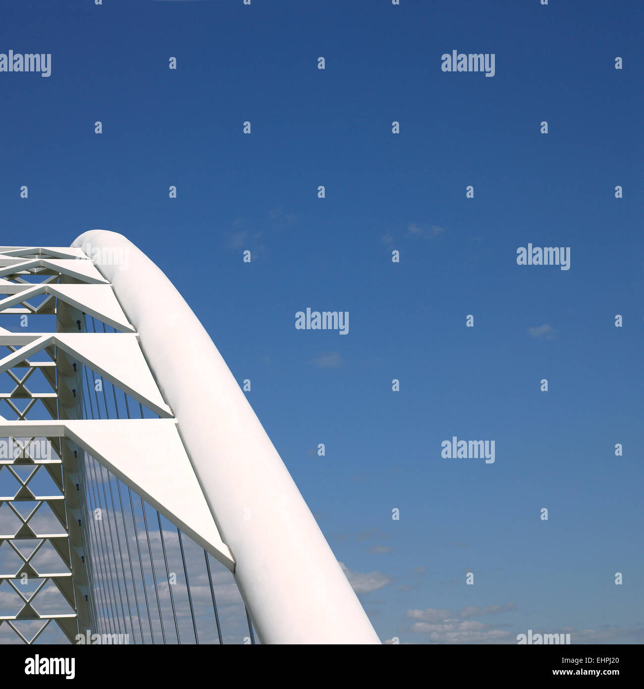 White steel curved modern bridge Stock Photo - Alamy