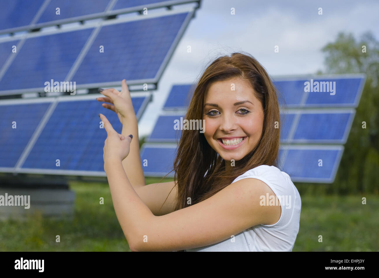 smiling girl with solar panels Stock Photo - Alamy