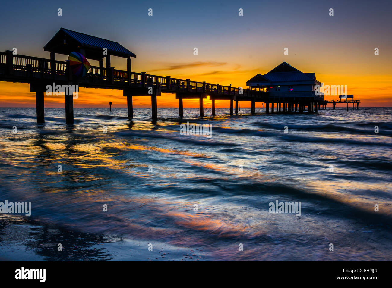 Fishing pier in the Gulf of Mexico at sunset, Clearwater Beach, Florida ...