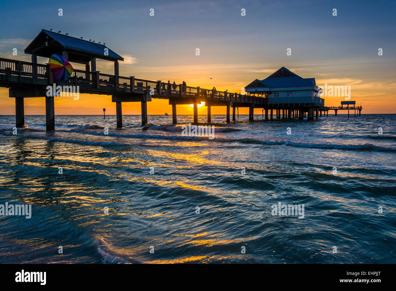 Fishing pier in the Gulf of Mexico at sunset, Clearwater Beach, Florida ...