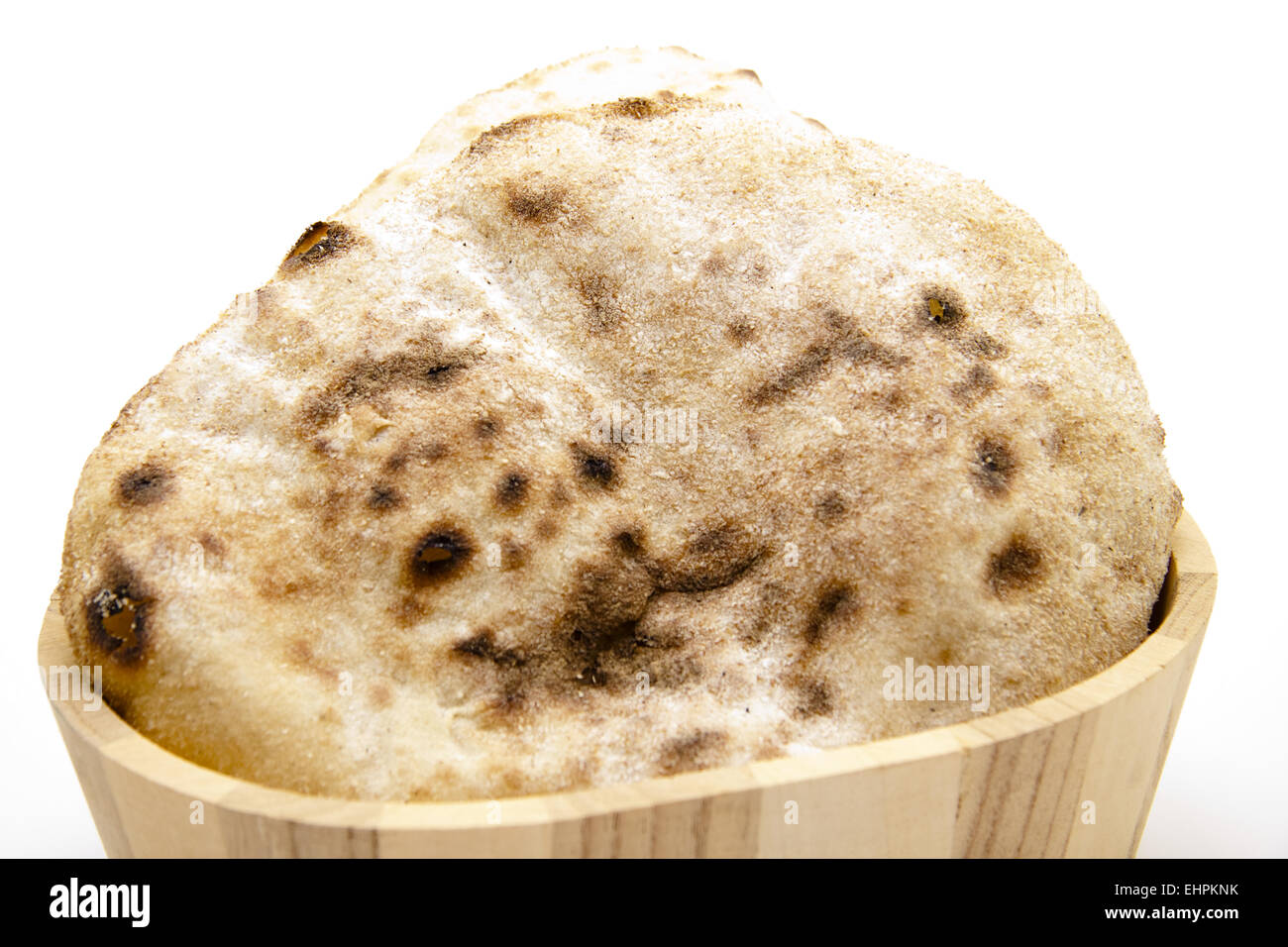Round flat dough-cake bread in the container Stock Photo - Alamy