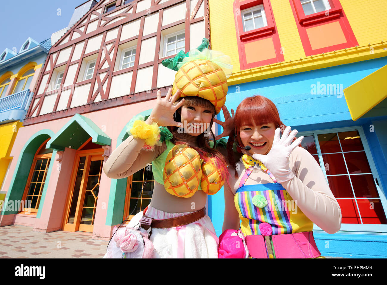 Dancers in colorful costumes participate in a parade Stock Photo - Alamy
