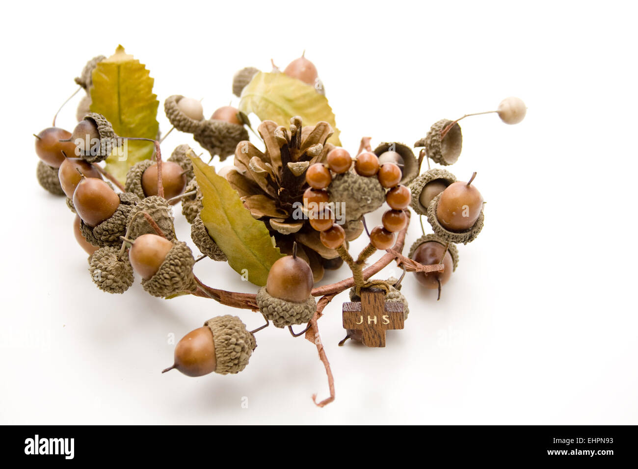 Wooden cross with acorn wreath Stock Photo - Alamy