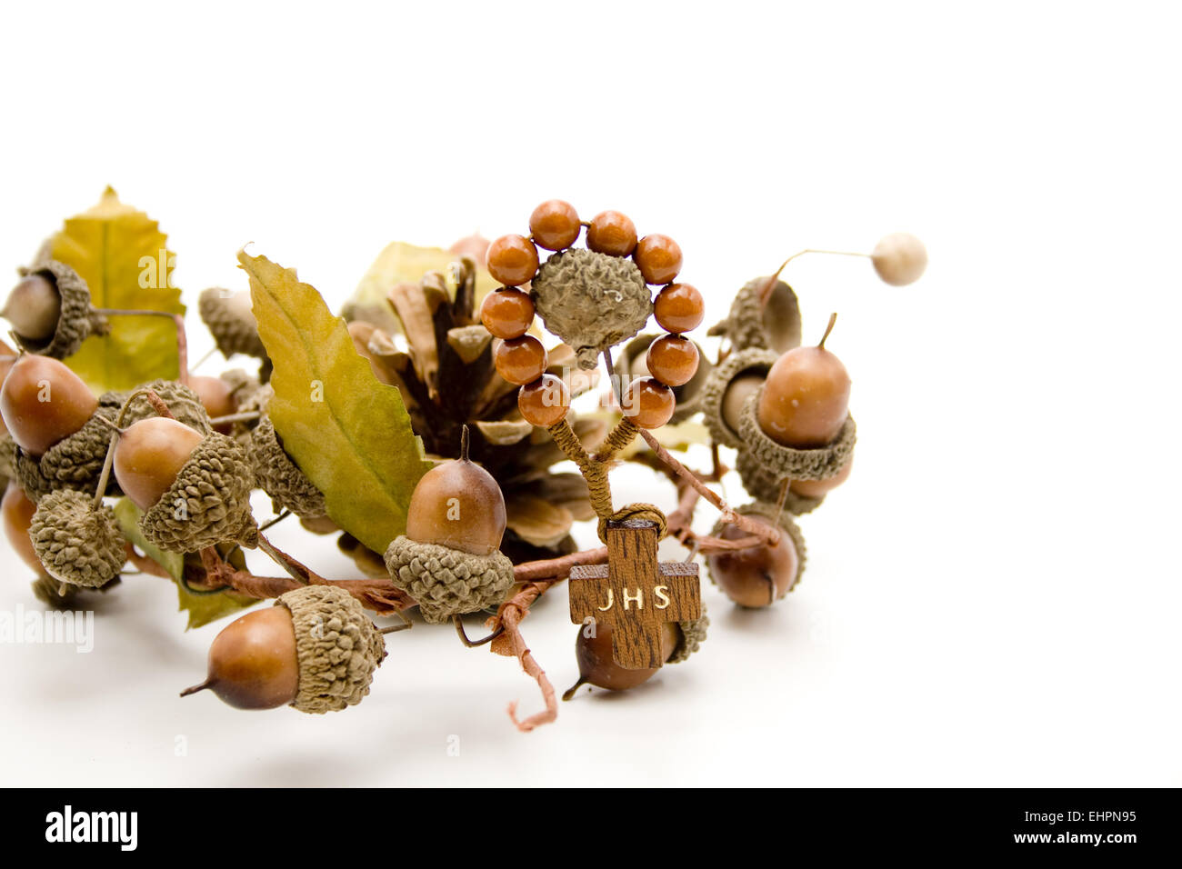 Wooden cross with acorn wreath Stock Photo - Alamy