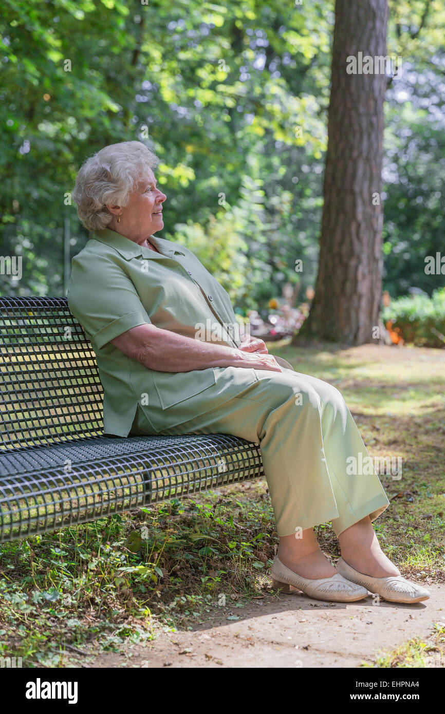 senior sit on a bank Stock Photo - Alamy