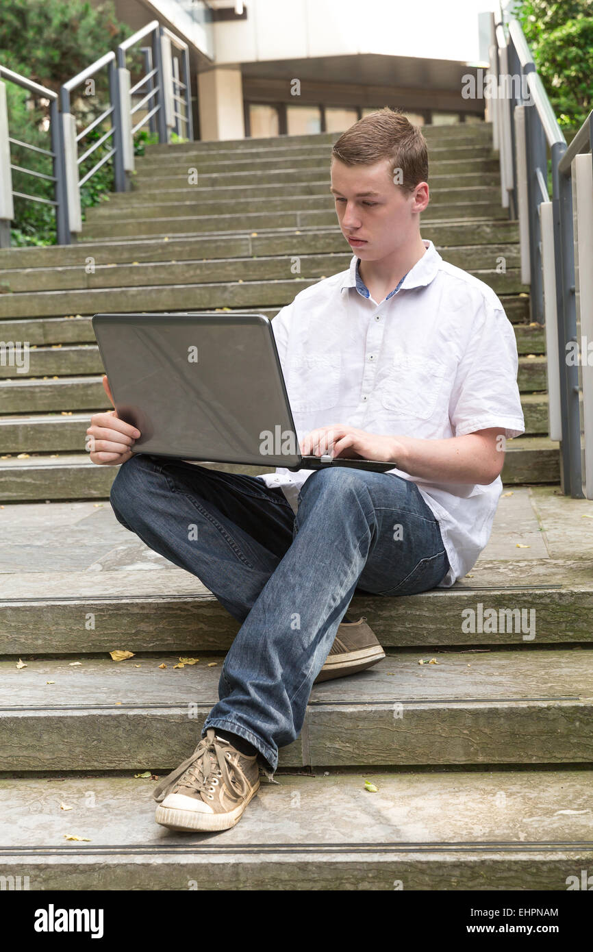young man with laptop 4 Stock Photo - Alamy