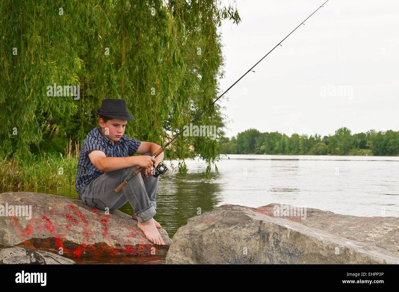 Young boy child kid fishing hi-res stock photography and images - Alamy