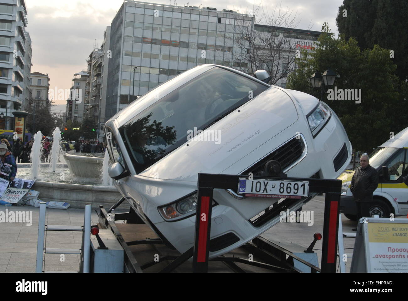 A special car rig is used to show what happens when a car is toppled ...
