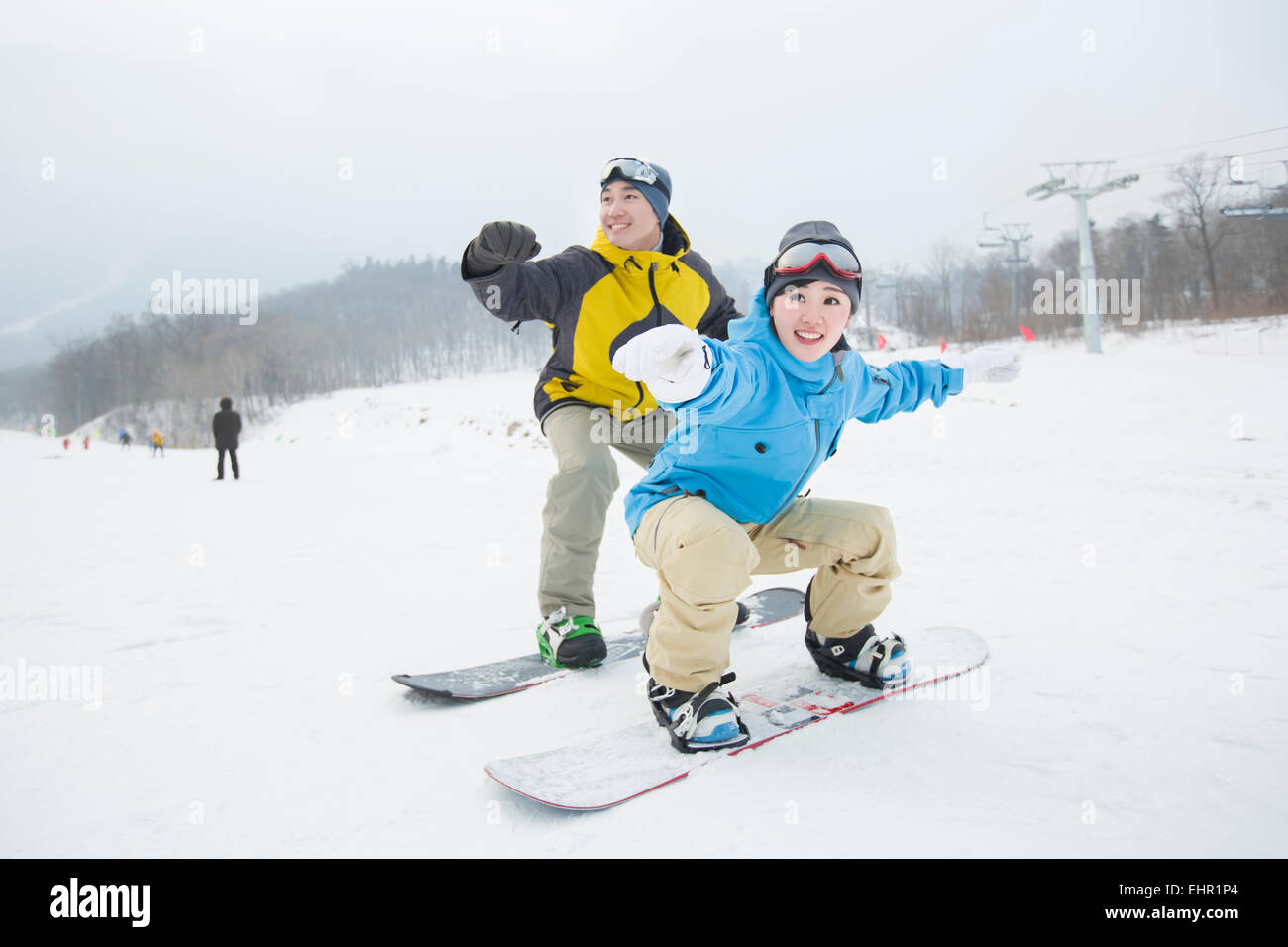 Couple snowboarding hi-res stock photography and images - Alamy