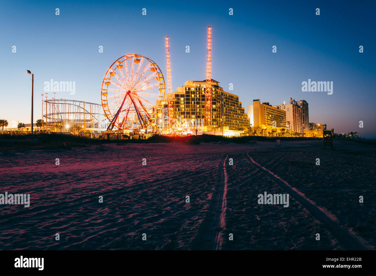 Tire tracks on the beach, rides and hotels at night, in Daytona Beach ...