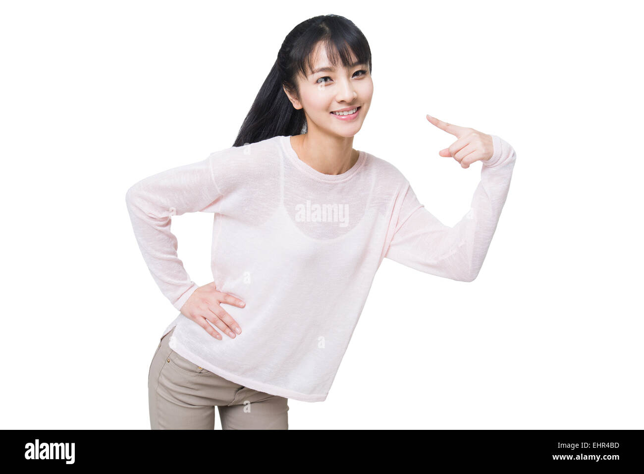 Happy young woman pointing her face Stock Photo - Alamy