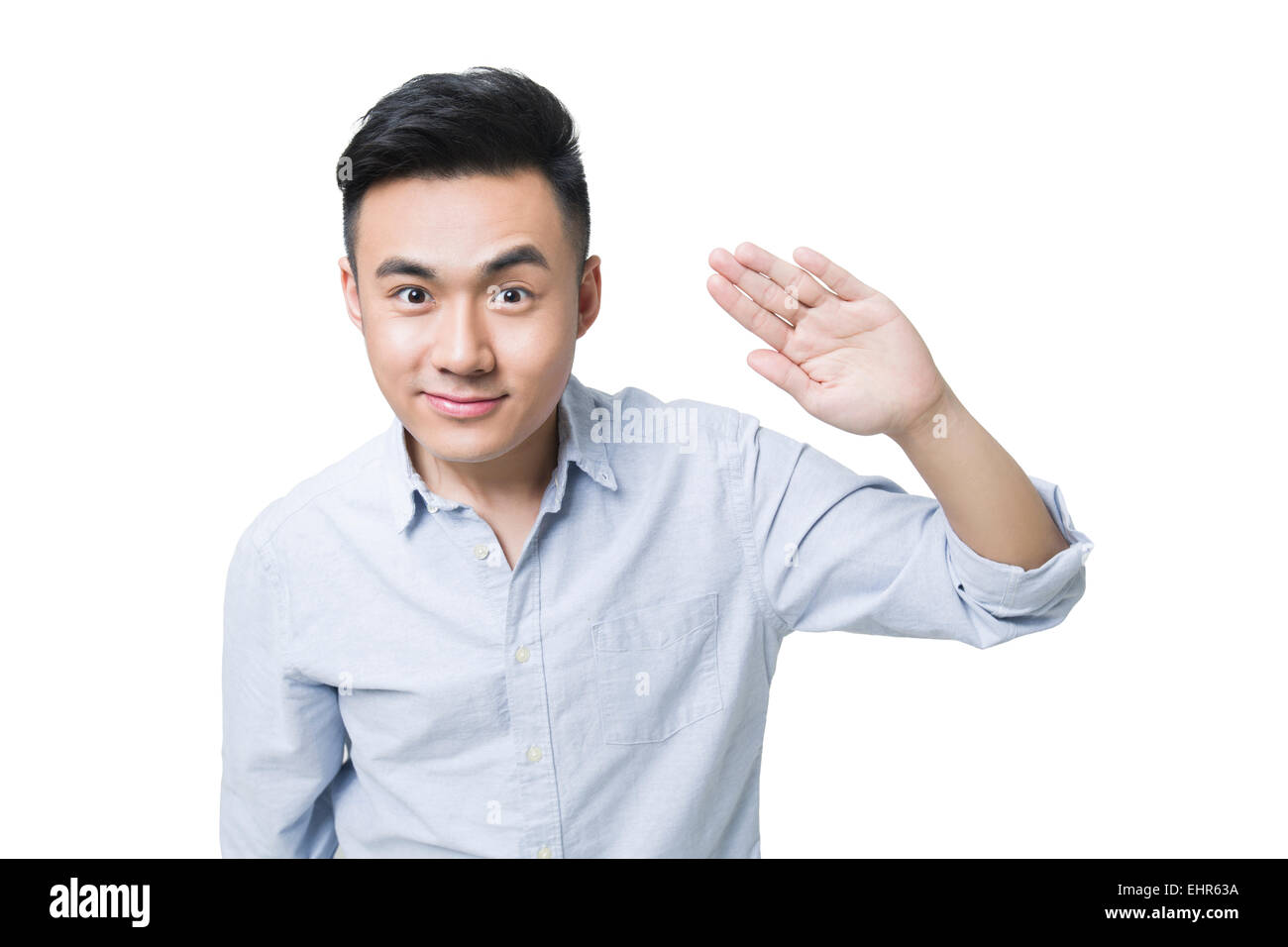 Young man waving Stock Photo - Alamy