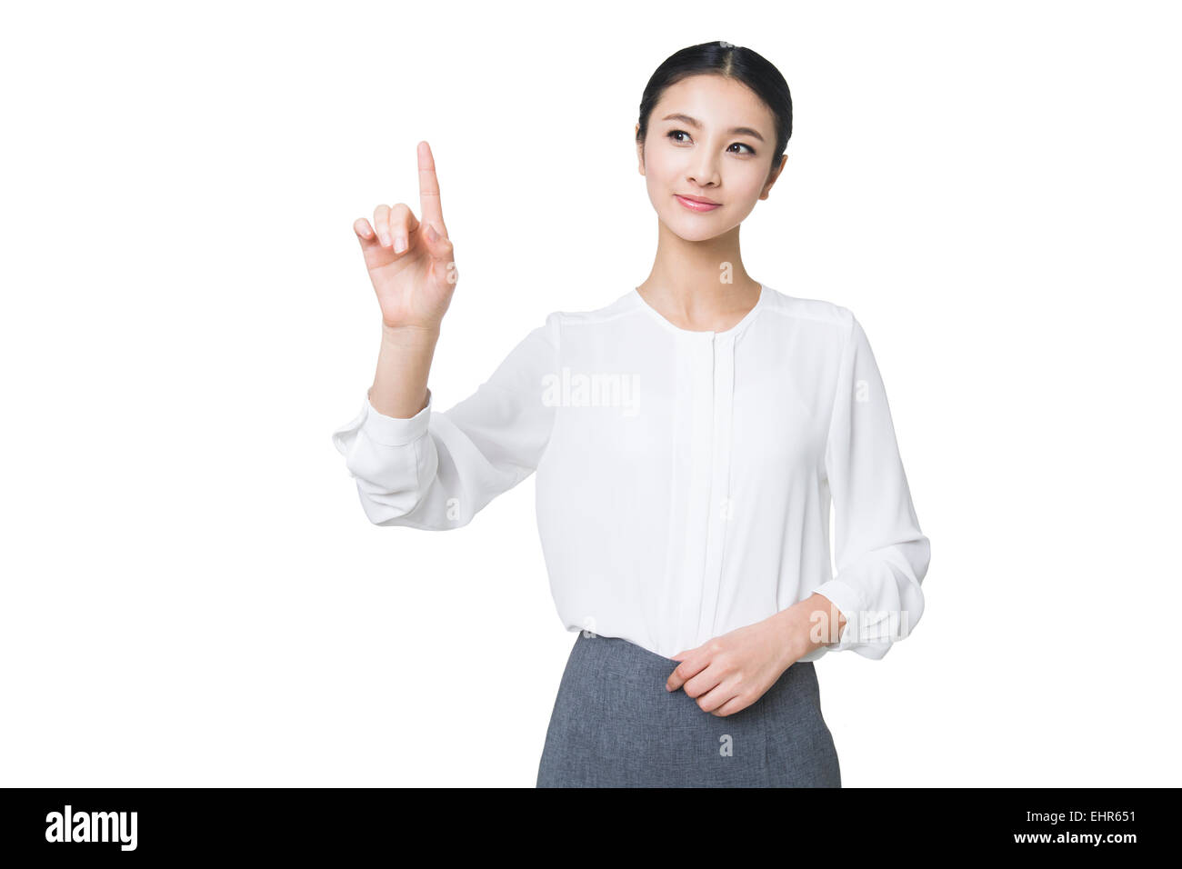 Young woman using finger to point Stock Photo - Alamy