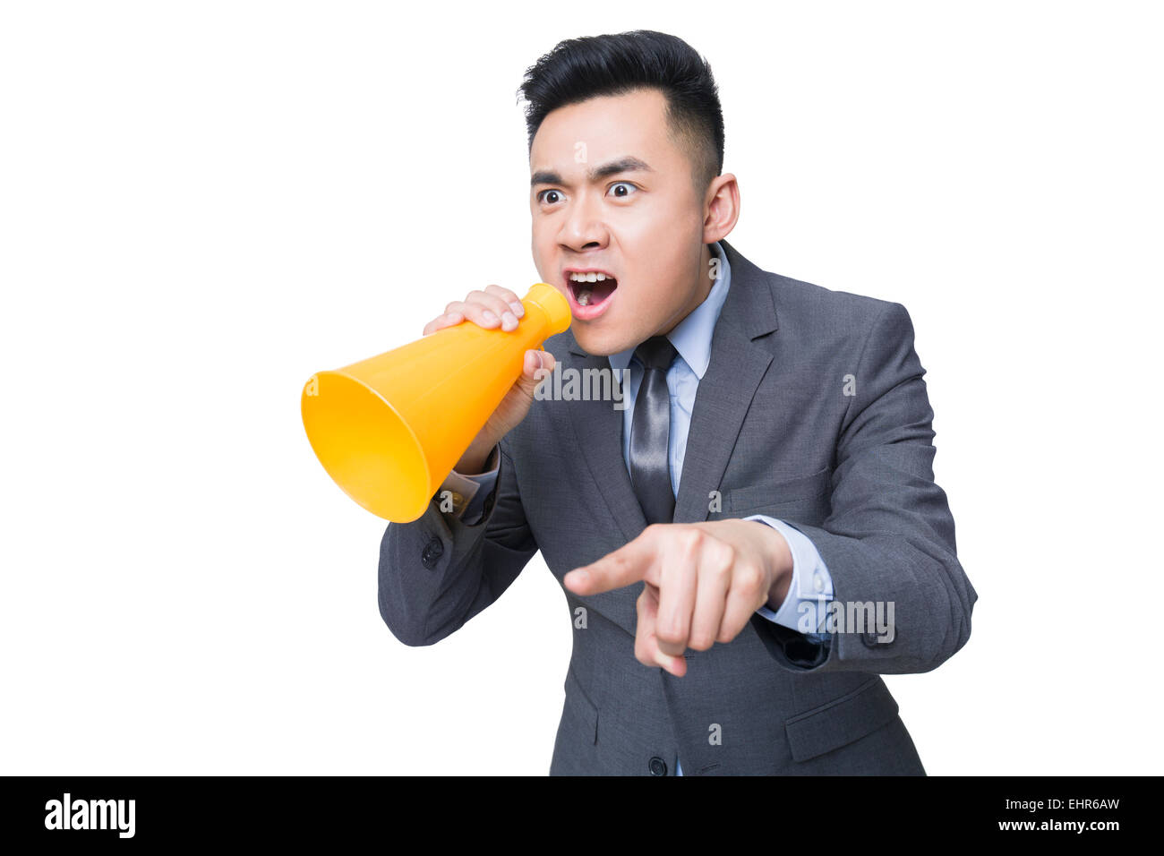 Young businessman shouting into megaphone Stock Photo - Alamy