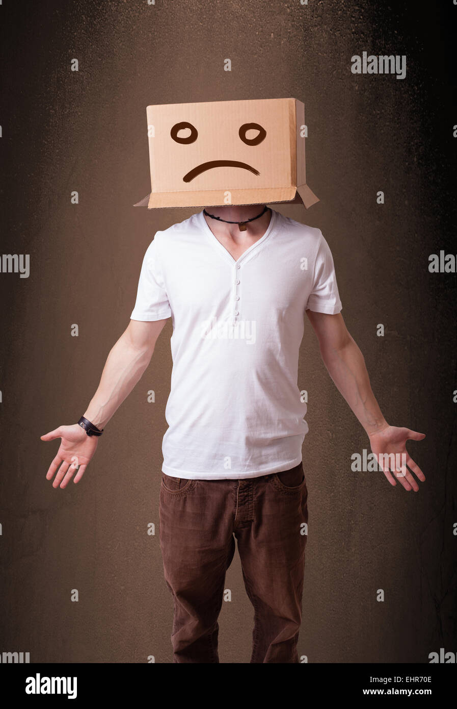 Young man with a brown cardboard box on his head with sad face Stock ...