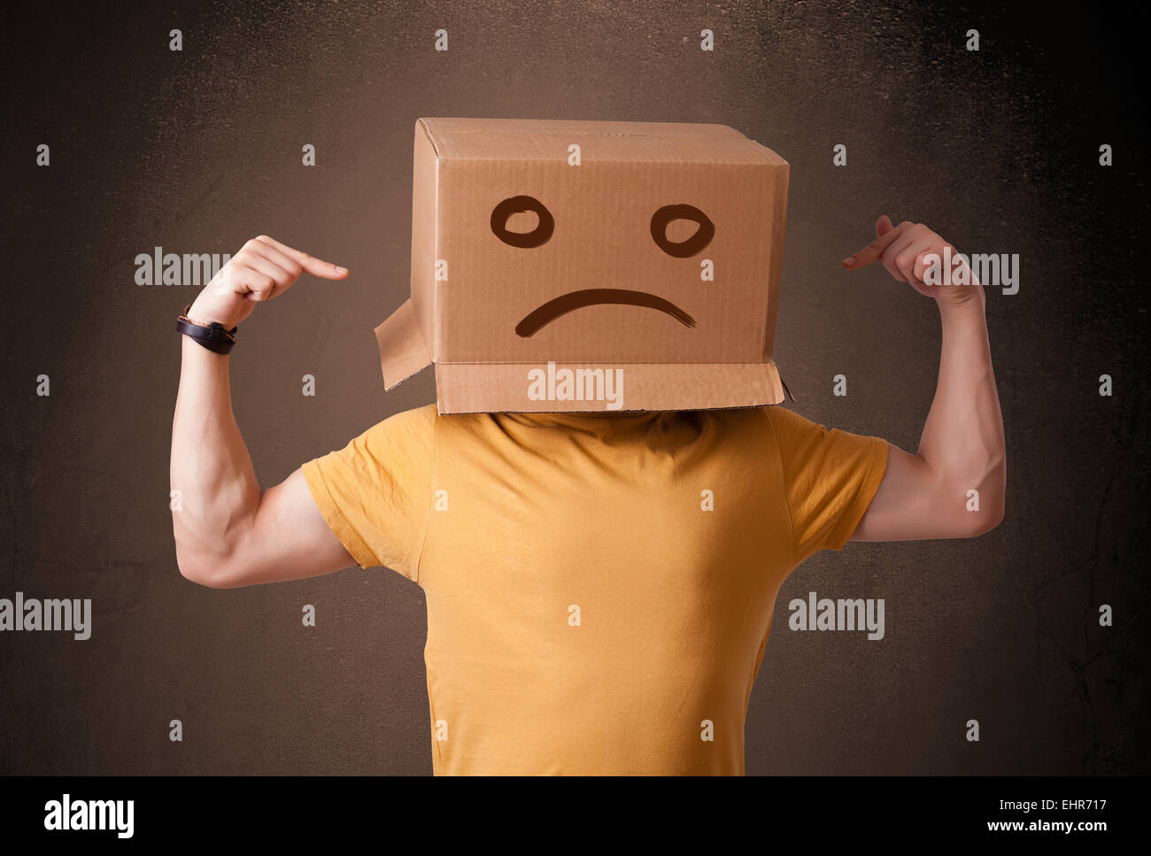 Young man with a brown cardboard box on his head with sad face Stock ...