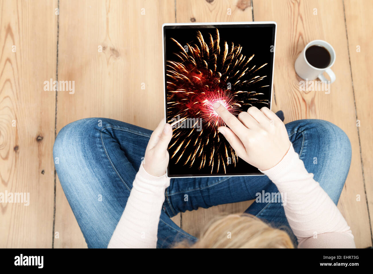 woman pointing on fireworks on tablet Stock Photo - Alamy