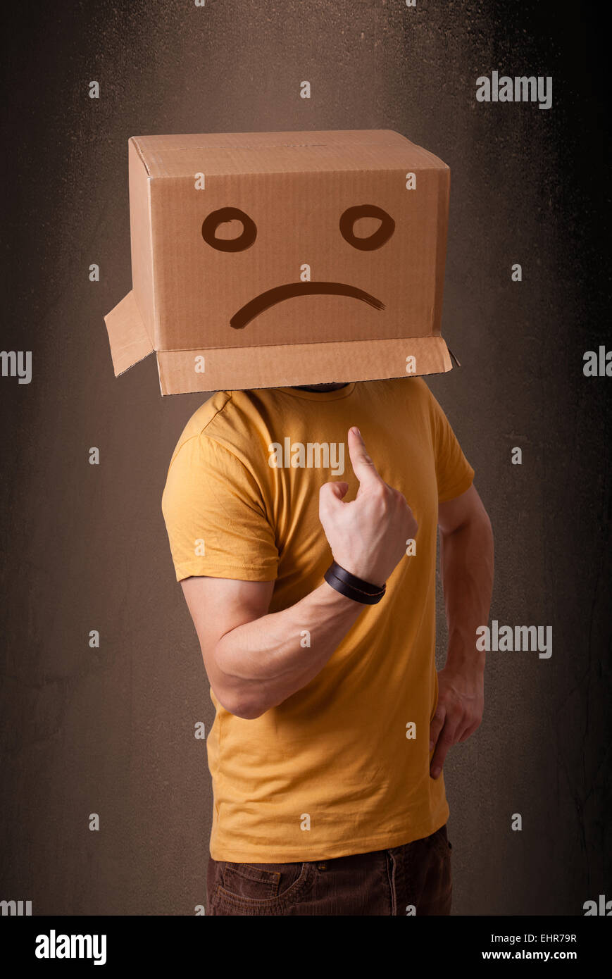 Young man with a brown cardboard box on his head with sad face Stock ...