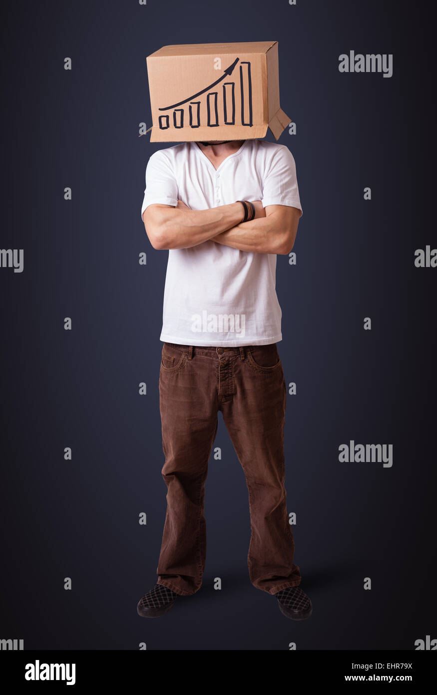 Young man gesturing with a cardboard box on his head with diagram Stock ...