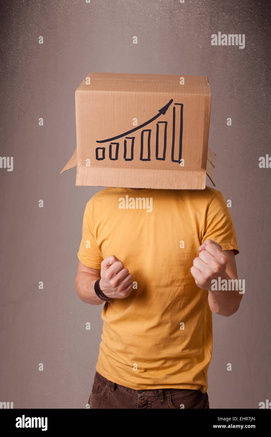 Young man gesturing with a cardboard box on his head with diagram Stock ...