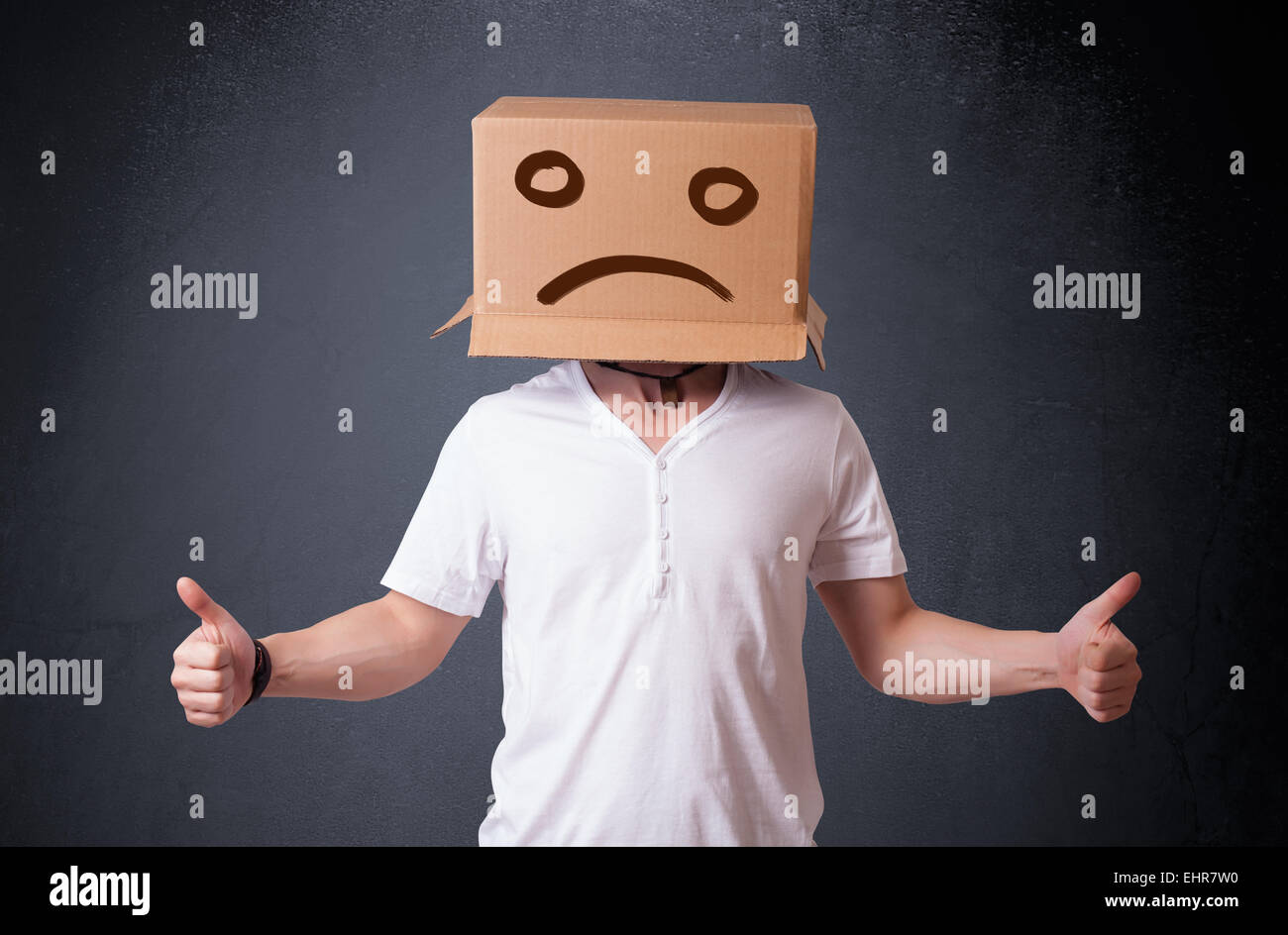 Young man with a brown cardboard box on his head with sad face Stock ...