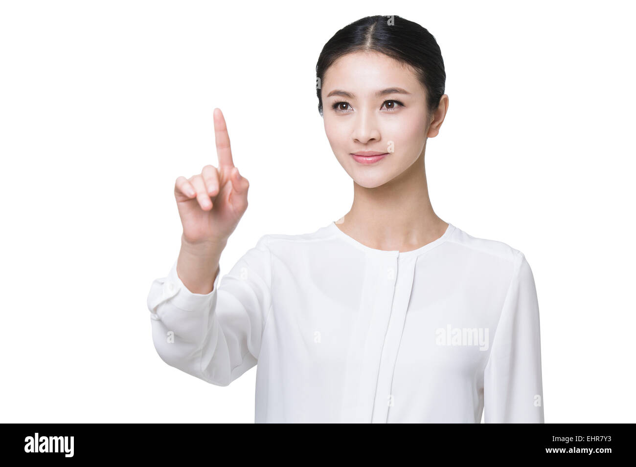 Young woman using finger to point Stock Photo - Alamy