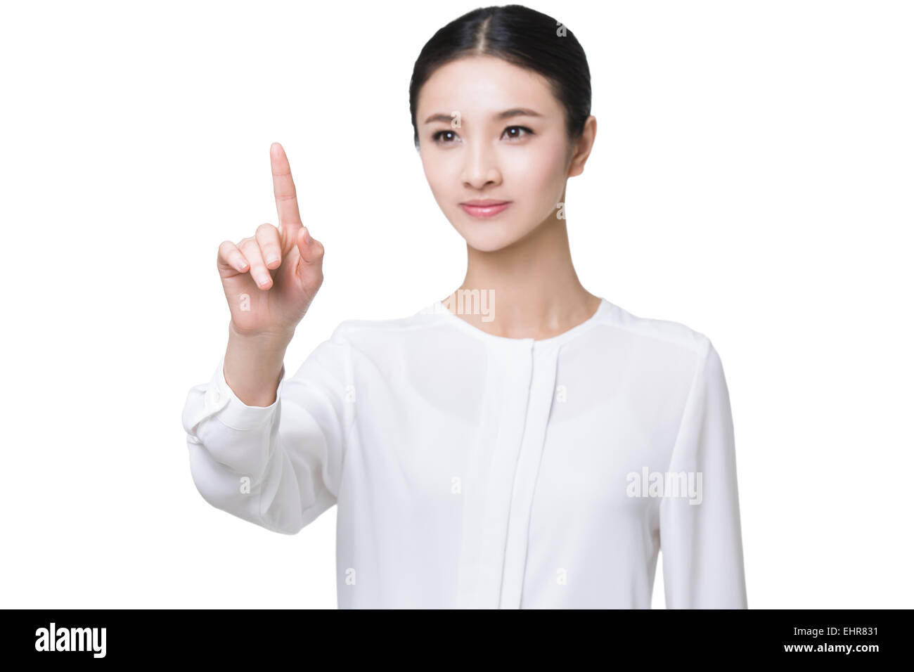 Young woman using finger to point Stock Photo - Alamy