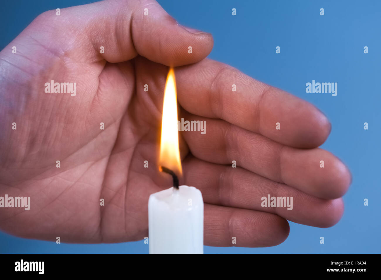 Hands Kindle candle Stock Photo - Alamy