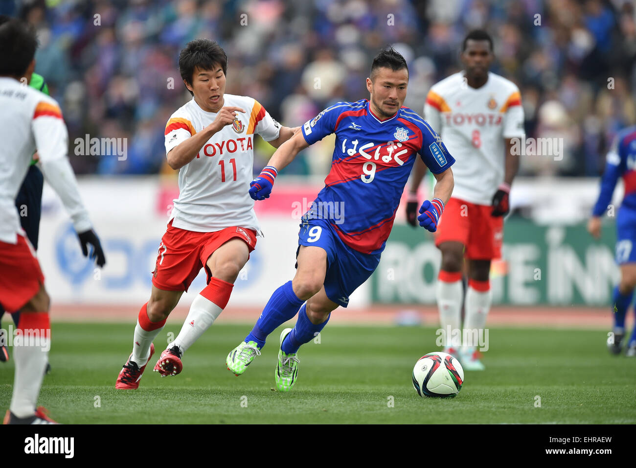 Yamanashi, Japan. 14th Mar, 2015. Kensuke Nagai (Grampus), Takuma Abe ...