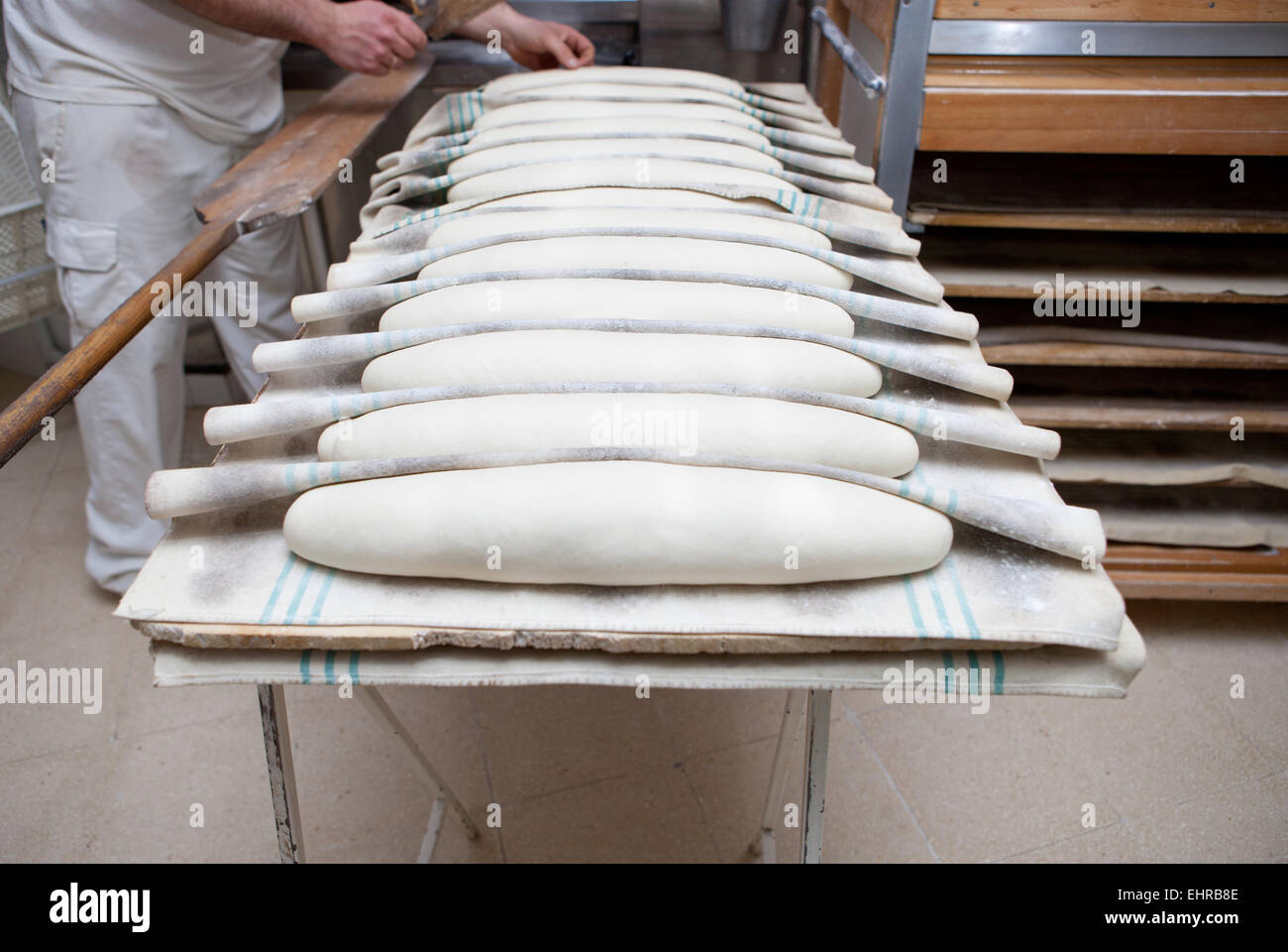 Baker putting baked bread hi-res stock photography and images - Alamy
