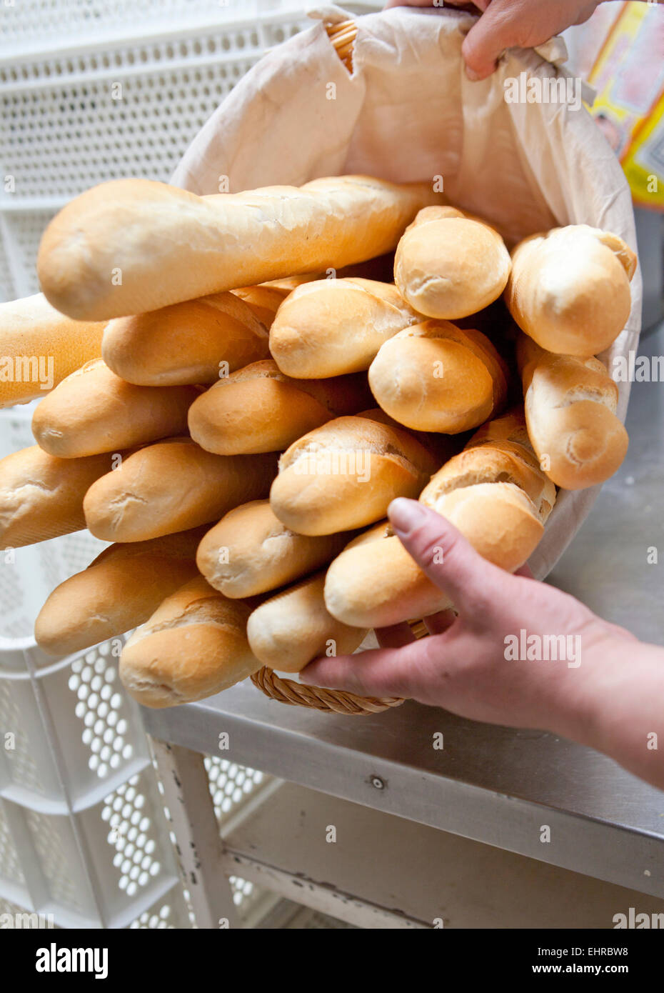 Baguette basket of bread loaves at bakery Stock Photo - Alamy