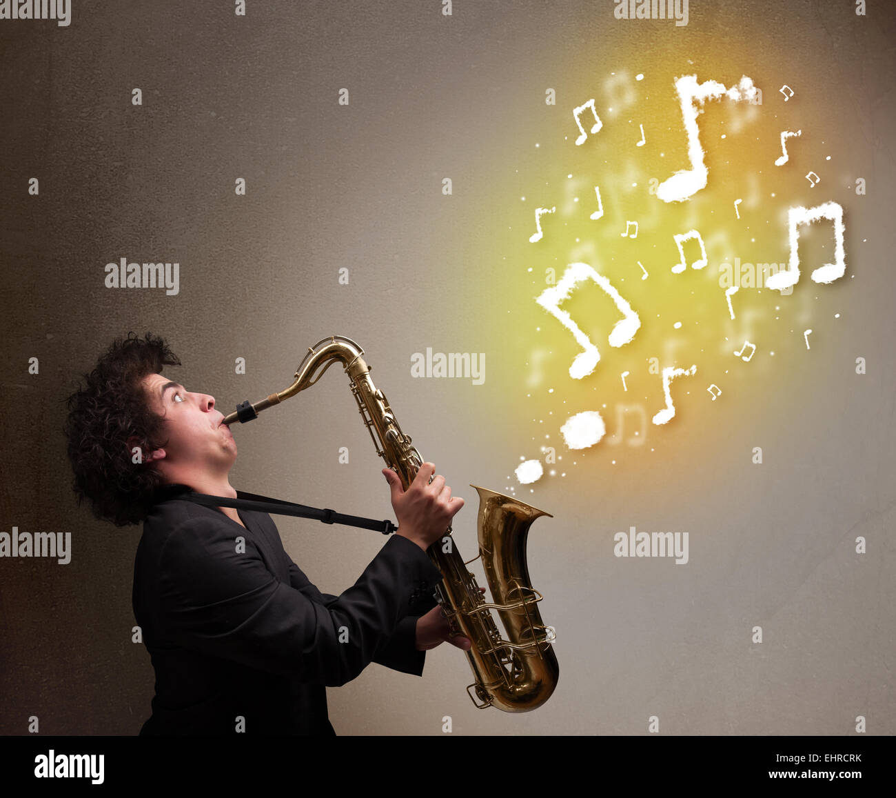 Handsome musician playing on saxophone with musical notes Stock Photo ...