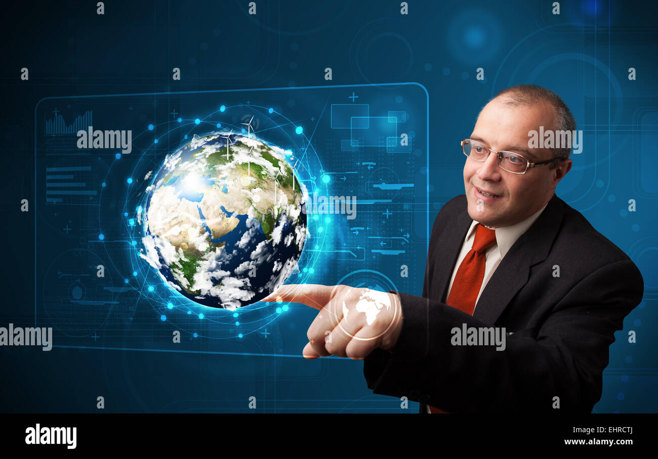 Businessman touching high-tech 3d earth panel Stock Photo - Alamy