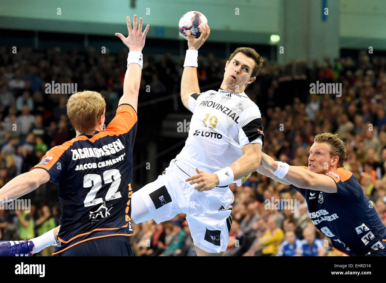 Flensburg, Germany. 15th Mar, 2015. Kiel's Rasmus Lauge Schmidt (c) in ...