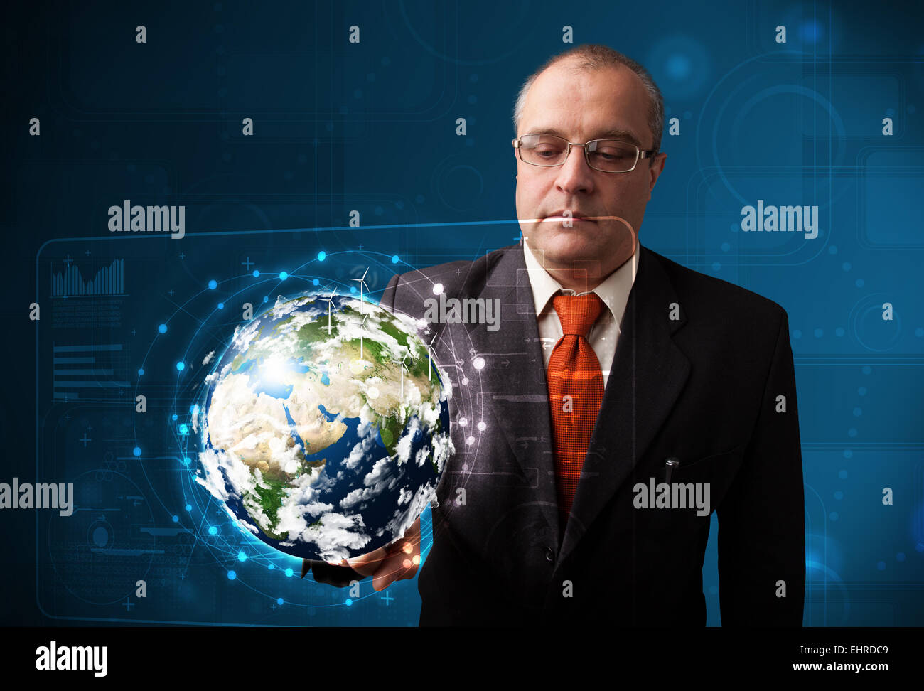 Businessman touching high-tech 3d earth panel Stock Photo - Alamy