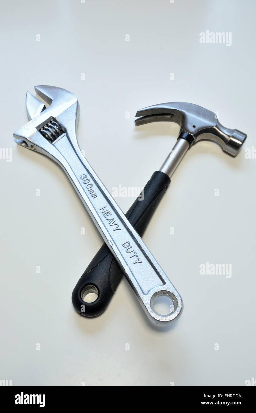 A wrench and a hammer. Tools for housekeeping, reconstructing, fixing ...