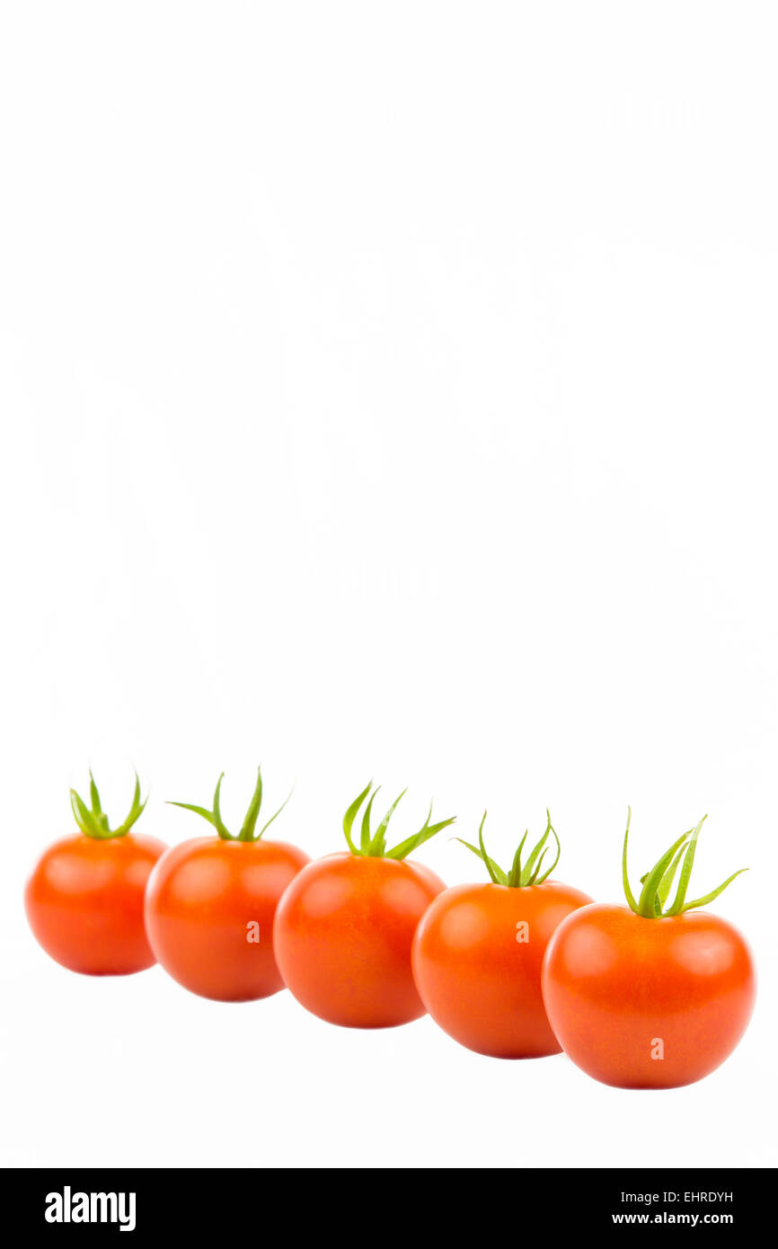 Five tomatoes in a row 3 Stock Photo - Alamy