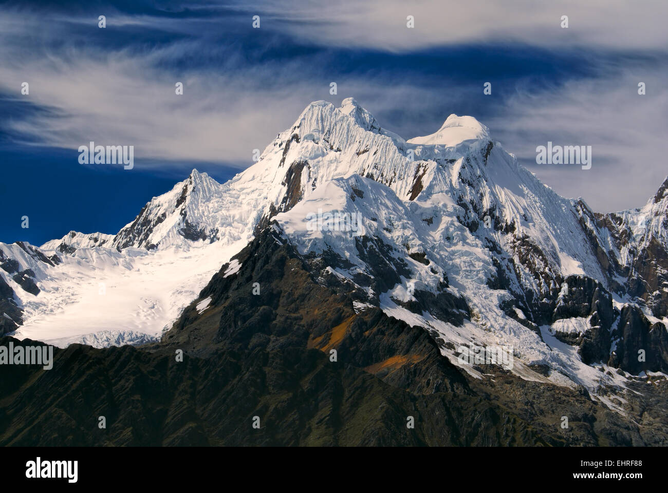 Majestic Alpamayo, one of highest mountain peaks in Peruvian Andes ...