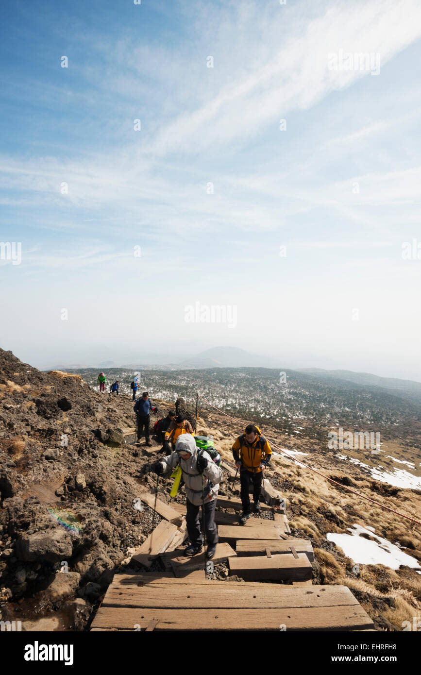 Asia, Republic of Korea, South Korea, Jeju island, hikers on volcanic ...