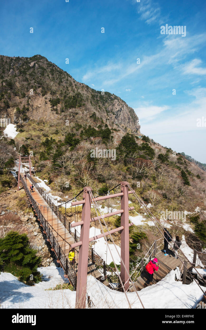 Asia, Republic of Korea, South Korea, Jeju island, hikers on volcanic ...