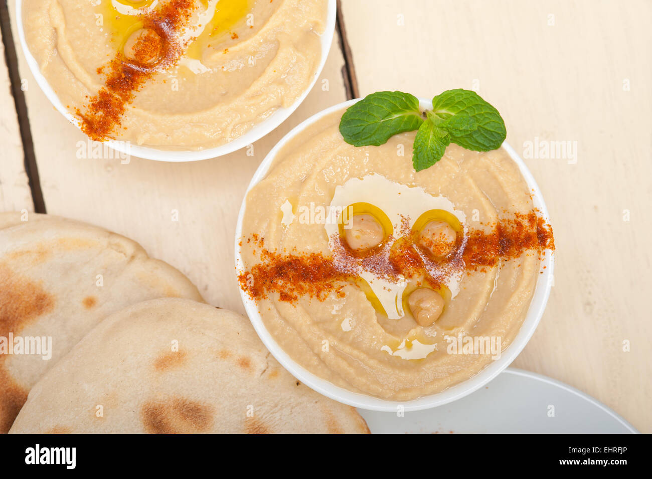 traditional chickpeas Hummus with pita bread and paprika on top Stock ...