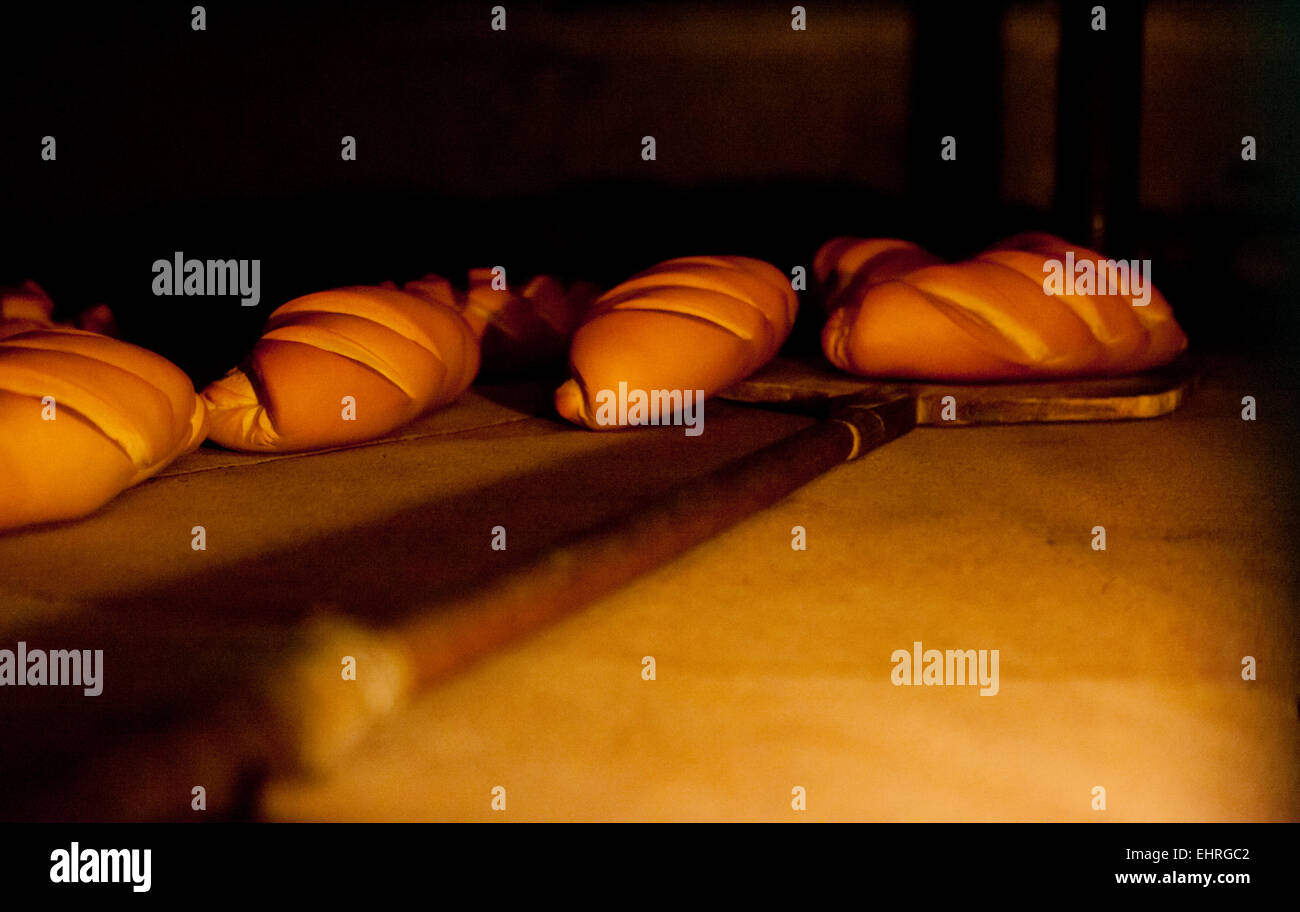 Oven inside plenty of bread. Manufacturing process of spanish bread ...