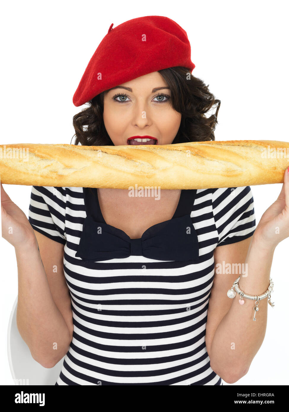 Confident Happy Young Woman Wearing A Red Beret And Striped Top Holding ...