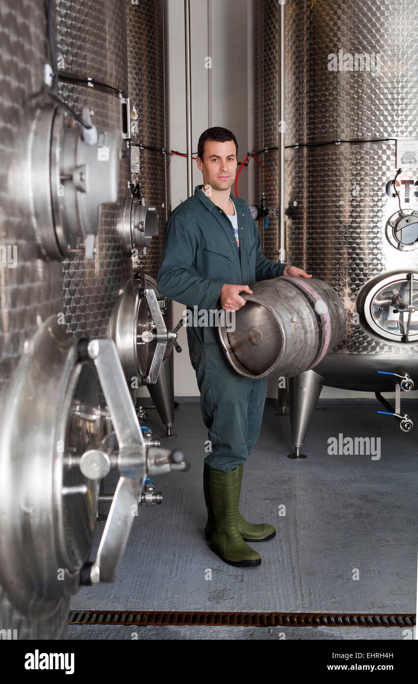 Staff Member holding Beer Barrel at the Hogs Back Brewery in Tongham ...