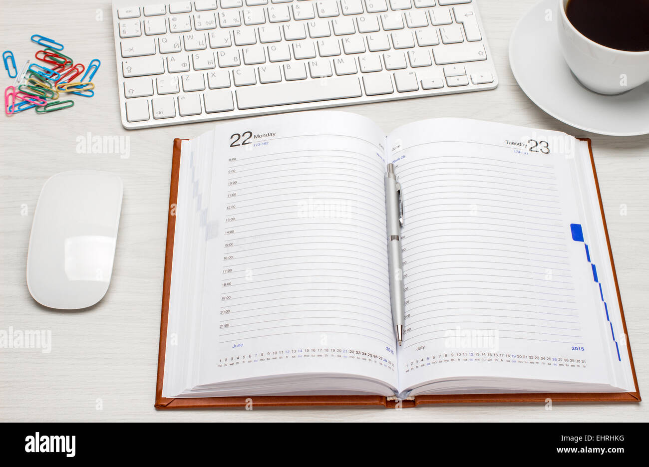 Office table with notepad, computer and coffee cup Stock Photo - Alamy
