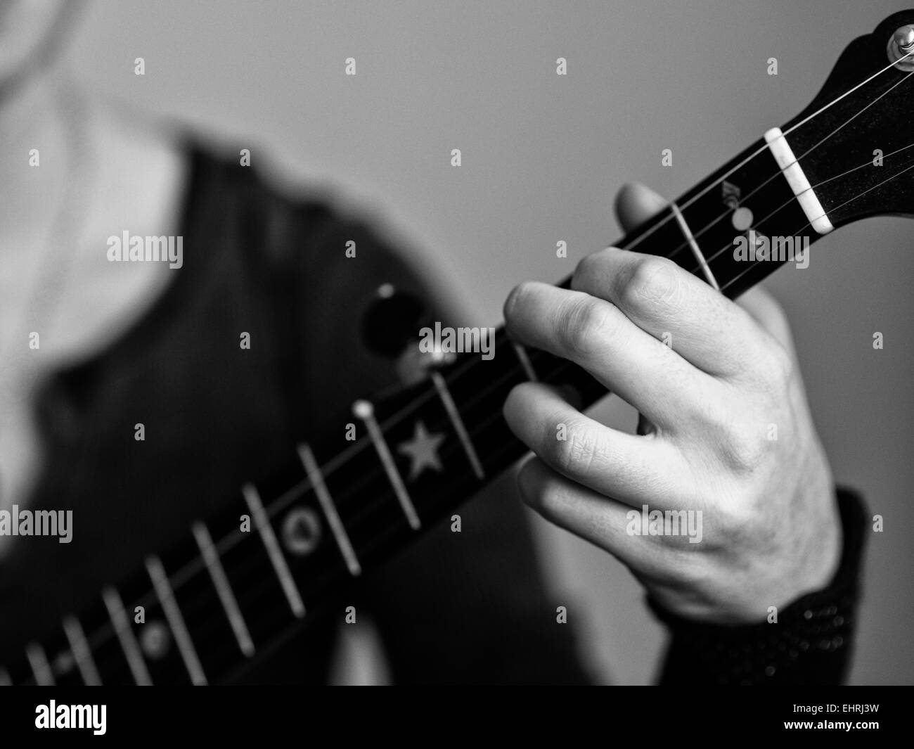 Closeup of a womans hands playing a banjo Stock Photo - Alamy