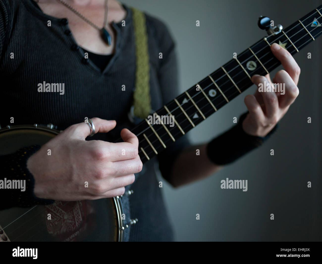Closeup of a womans hands playing a banjo Stock Photo - Alamy