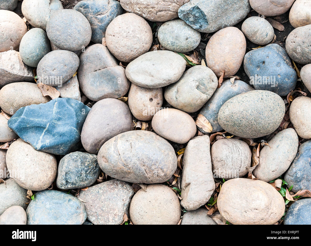 pebble stack on the ground of home garden Stock Photo - Alamy