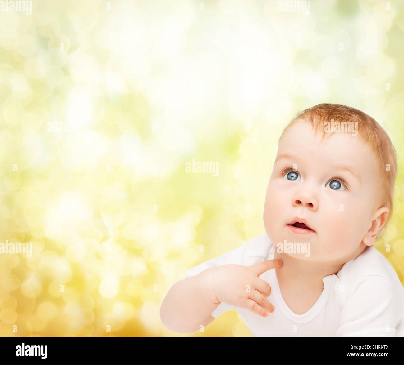 curious baby looking up Stock Photo - Alamy