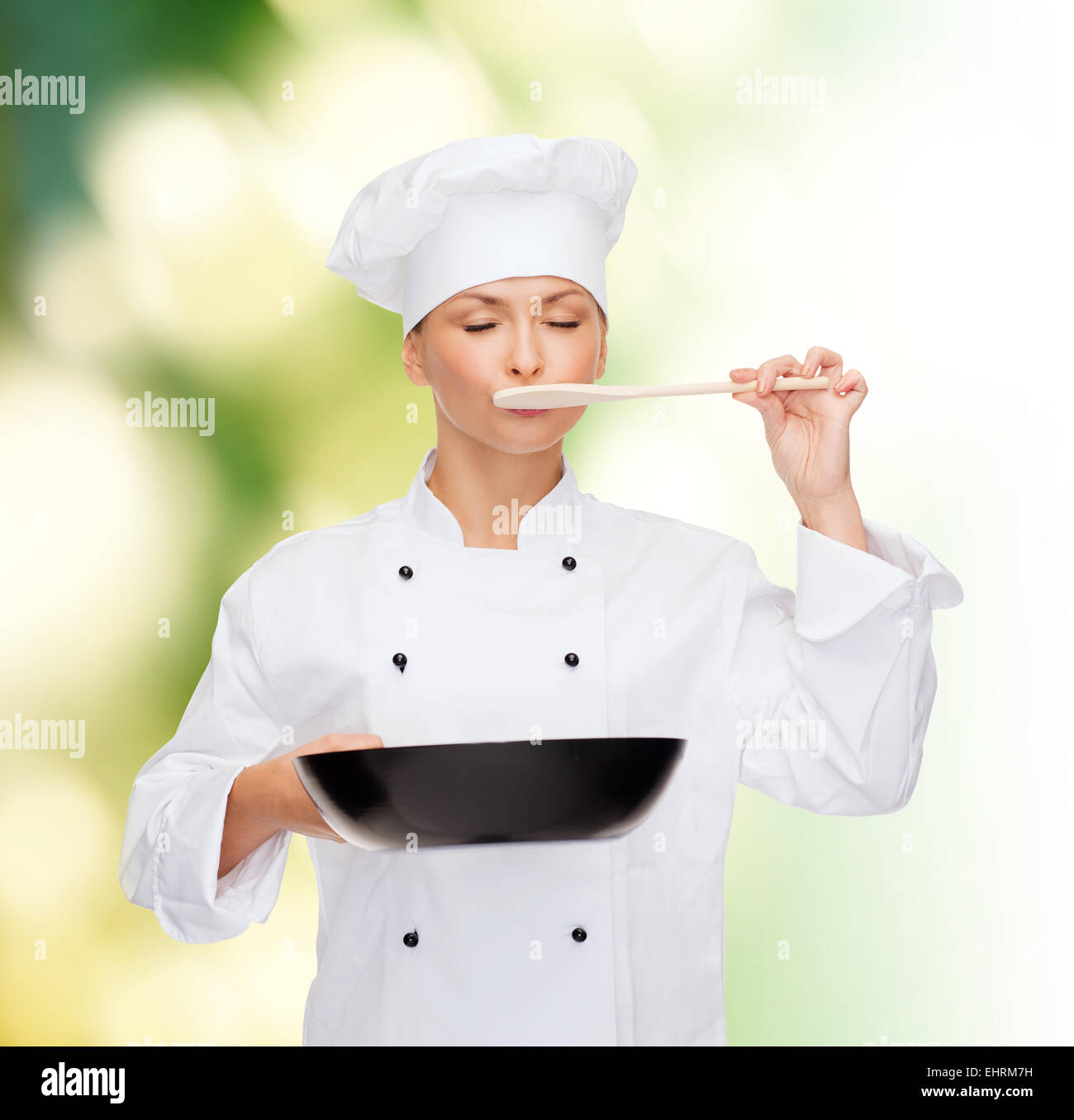 smiling female chef with pan and spoon Stock Photo - Alamy